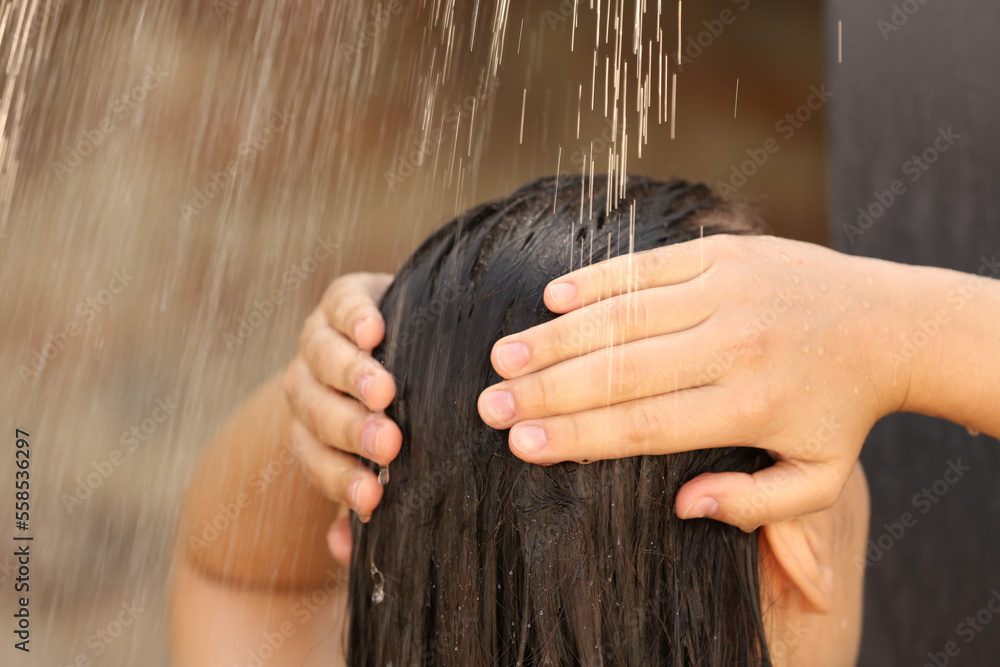 Woman washing hair in outdoor shower on summer day, closeup Stock Photo ...