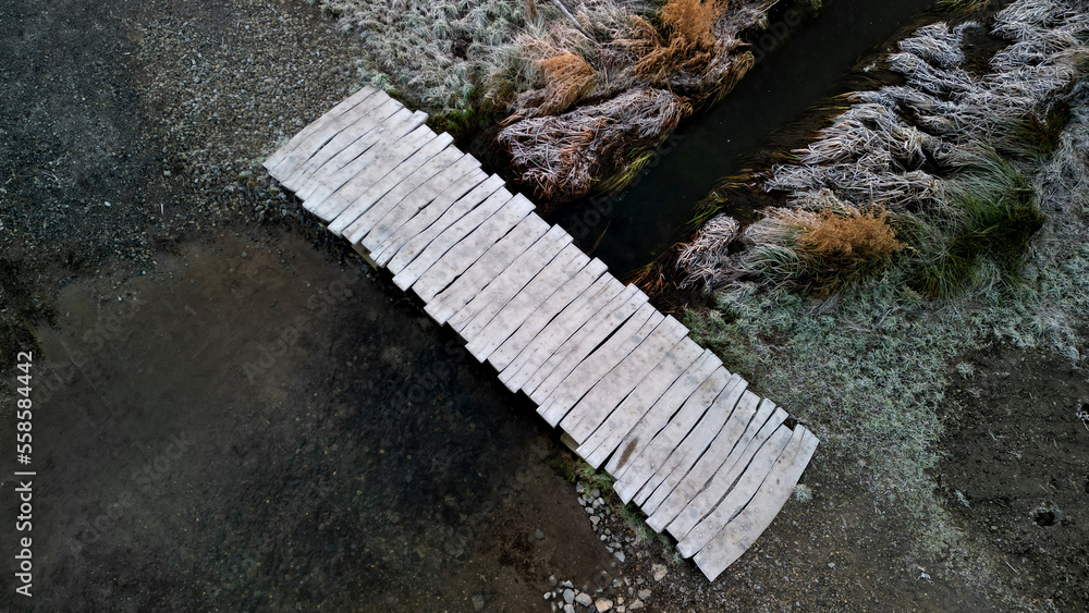 floating walkway made of wooden planks, pier, narrow curved paths on ...