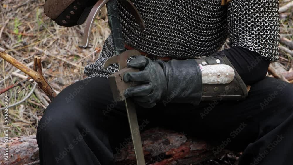 Smooth camera movement, selective focus, a man in chainmail with gray ...