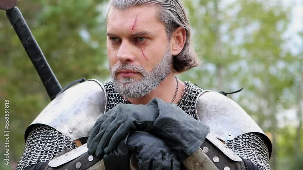 Portrait of a medieval warrior with gray hair and a scar on his face in ...