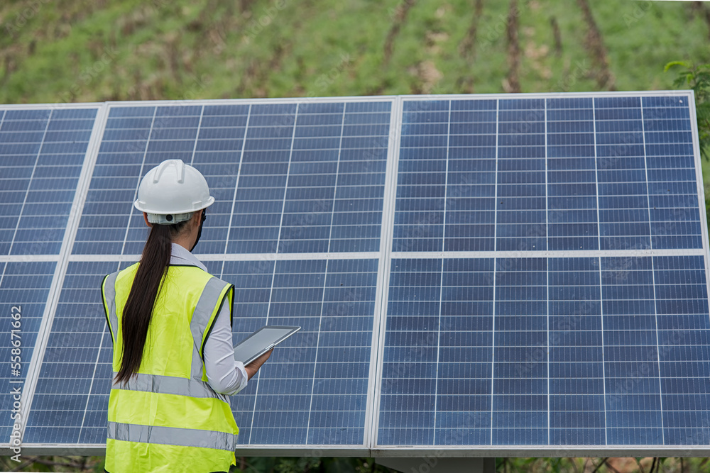 solar panel installation. back view of Asia woman engineer on Solar ...