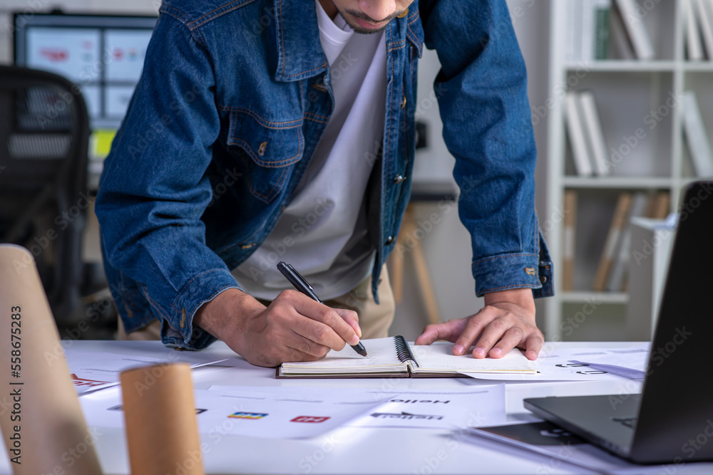 Graphic designer drawing sketches logo design. The concept of a new ...