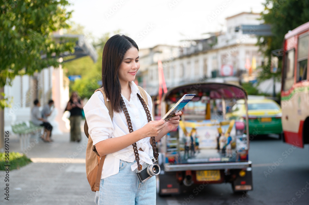 Beautiful tourist woman on vacation sightseeing and exploring Bangkok ...