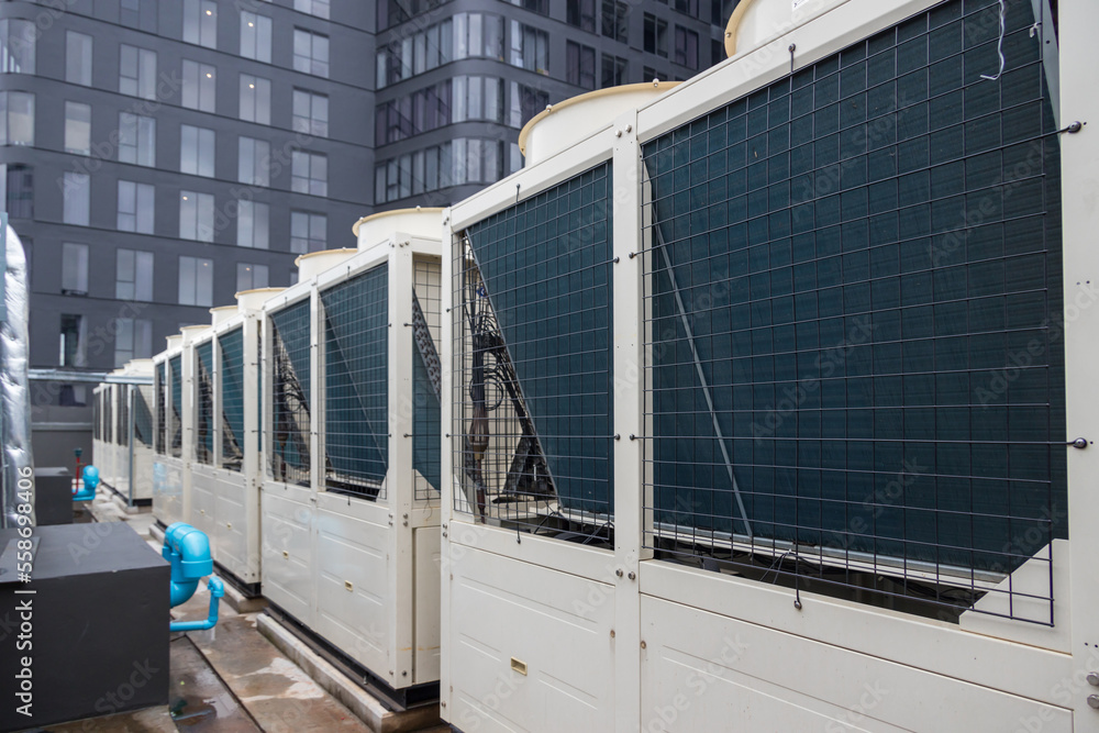 Air conditioner compressor installed on roof building. Industrial air ...