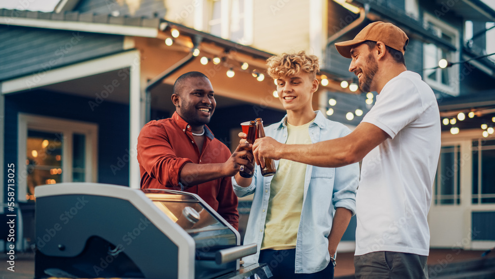 Young Man in a Cap Showing Off His Modern Fire Grill to Two Diverse ...