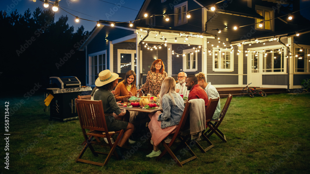 Parents, Children and Friends Gathered at a Barbecue Dinner Table ...