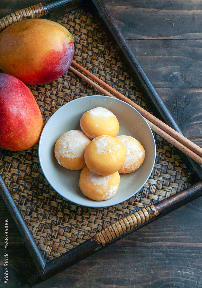 japanese mango mochi cakes with ice cream on a classic wooden asian ...