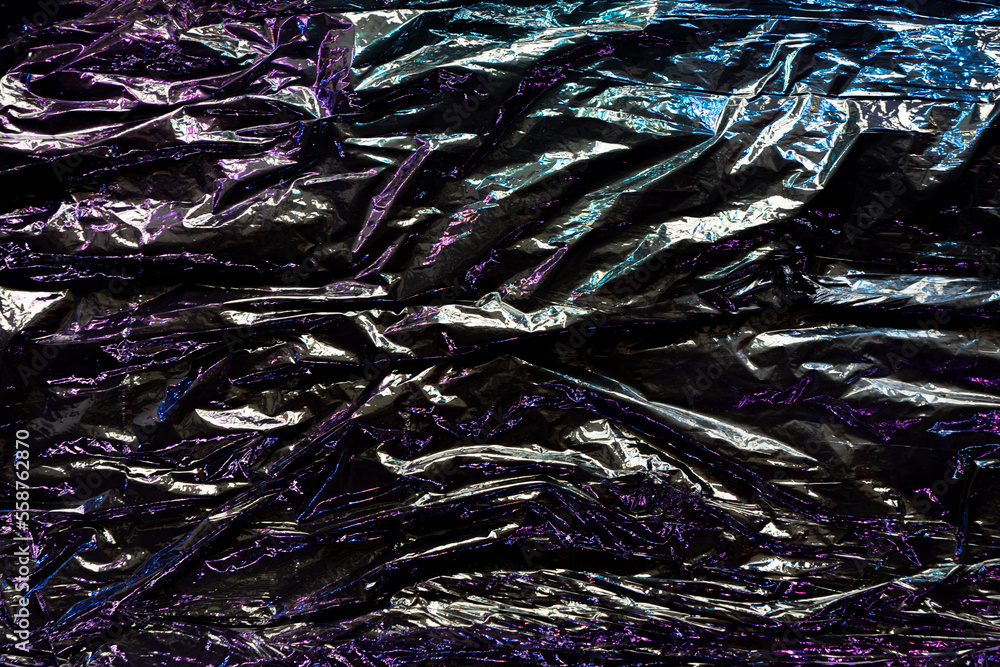 Black color plastic wrap background. Dark crumpled wrinkled plastic ...