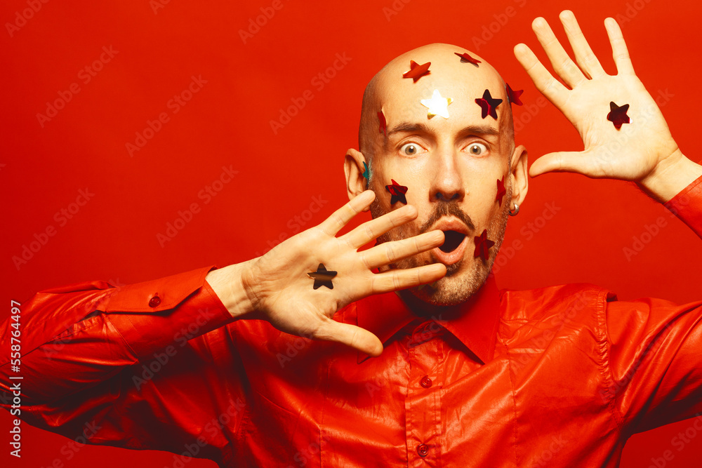 Wow concept. Handsome young bald 40 years old man with confetti stars ...