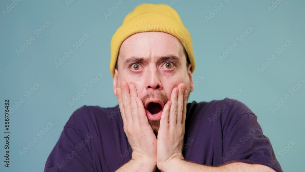 Shocked stunned People sincere emotions, on blue background, studio ...