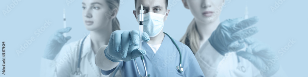 Doctors with syringes on blue background. Banner for design Stock Photo ...