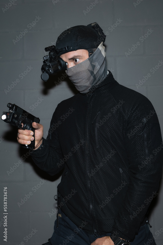 Special Forces with a pistol with a flashlight and a laser and a night ...