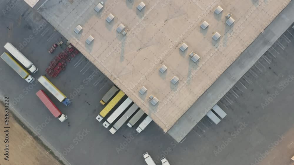 Aerial top down view of warehouses in a logistics park with a sorting ...
