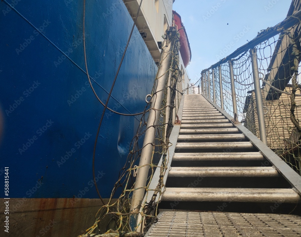 Stairway to heaven, Steep ladders, vessel gangway with nets on either ...