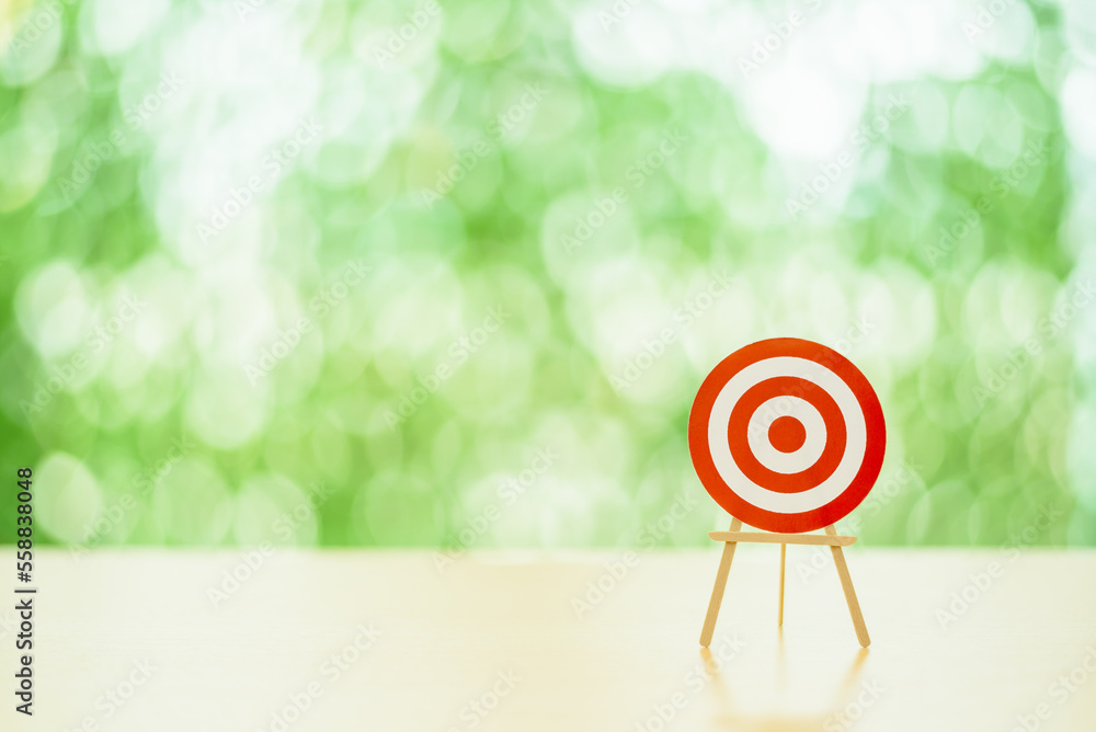 Blank circular target with no darts or a red bullseye on a table ...