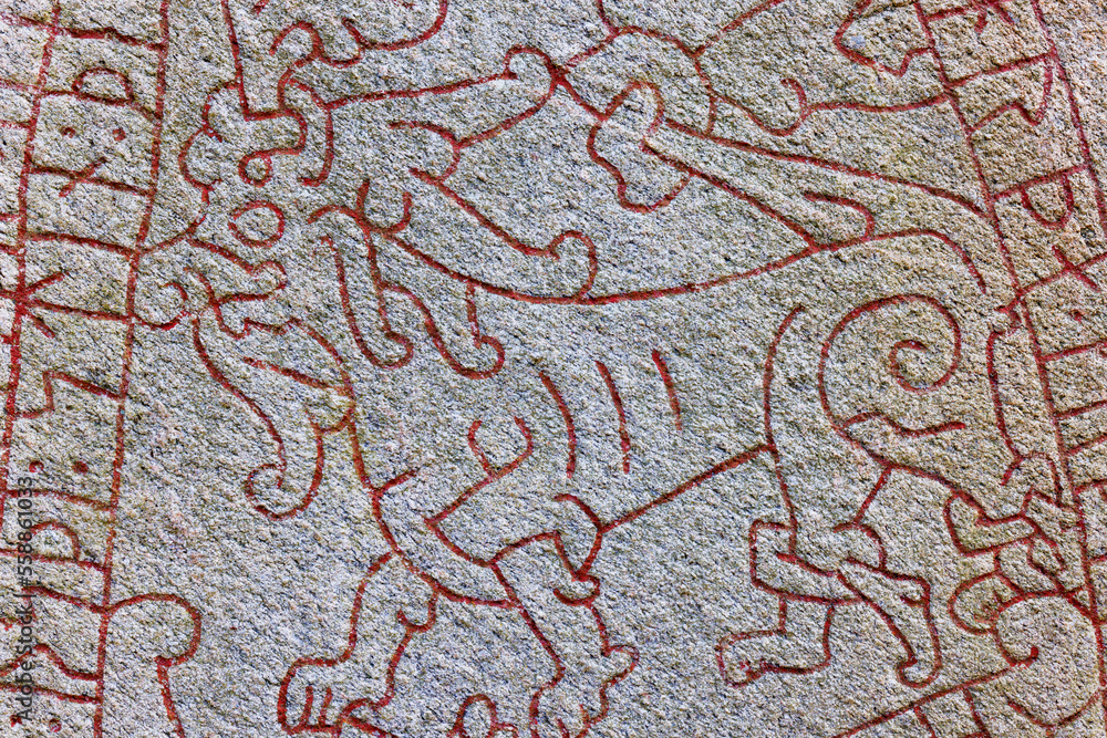 Runestone with beautiful animals and runes on Olsbrostenen Stock Photo ...