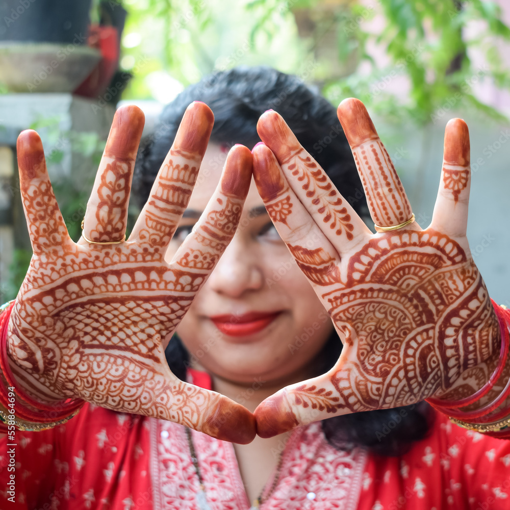 Beautiful woman dressed up as Indian tradition with henna mehndi design ...