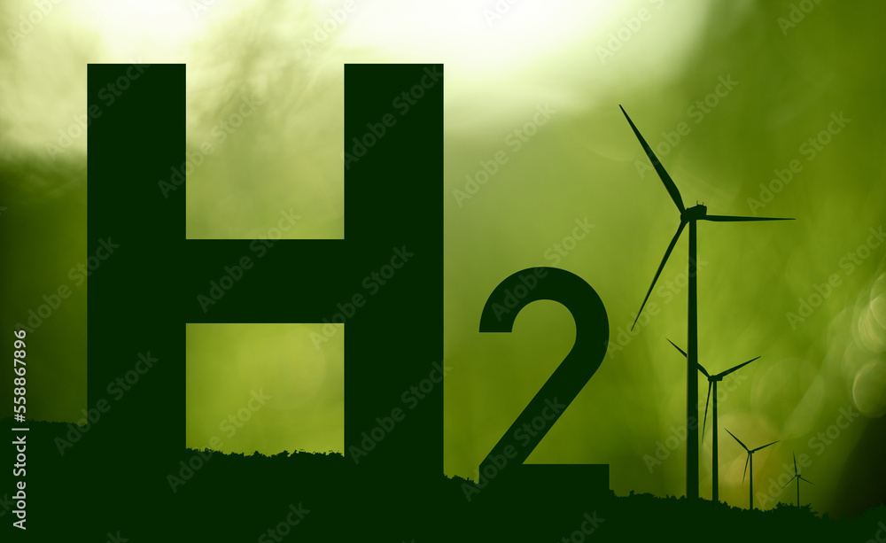 Silhouettes of Hydrogen symbol and wind turbines. Getting green ...
