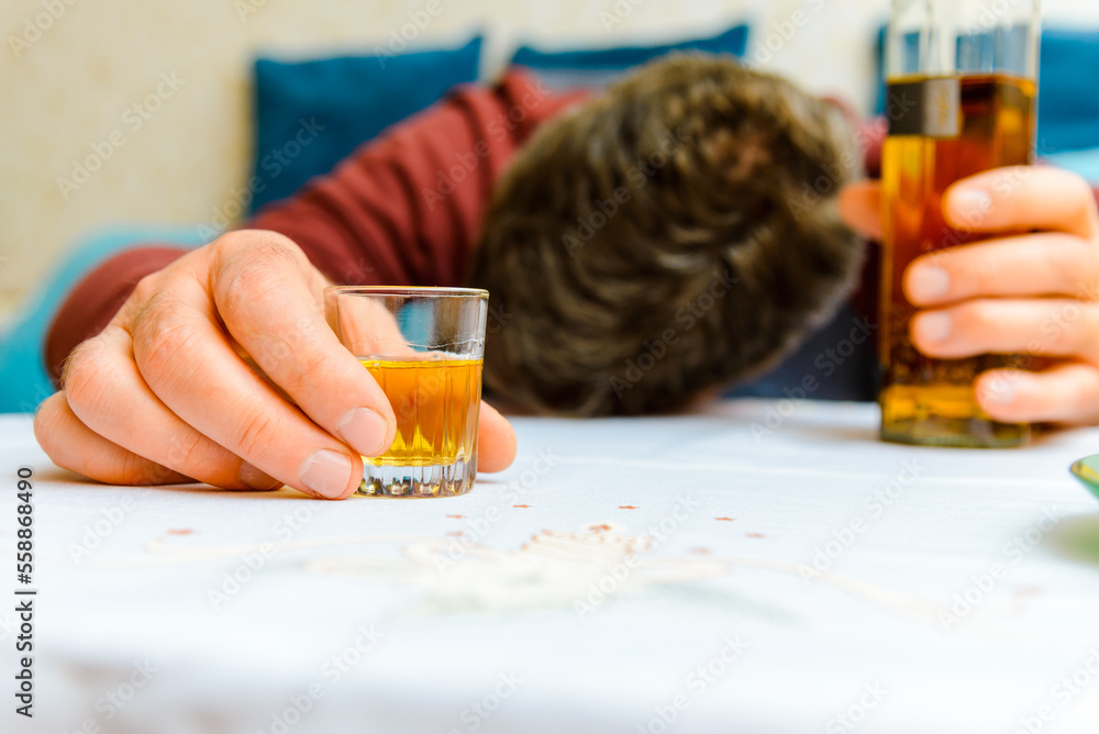 Uncontrolled consumption of alcohol,alcoholizm disease.Closeup of ...