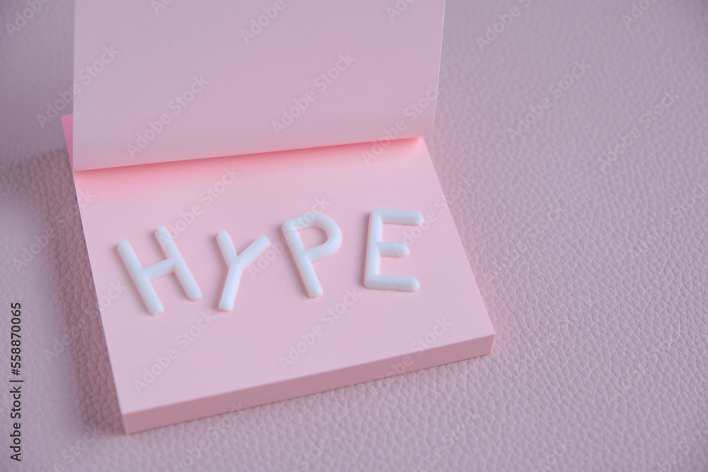 Word hype laid out white letters pink piece paper.Concept hype ...