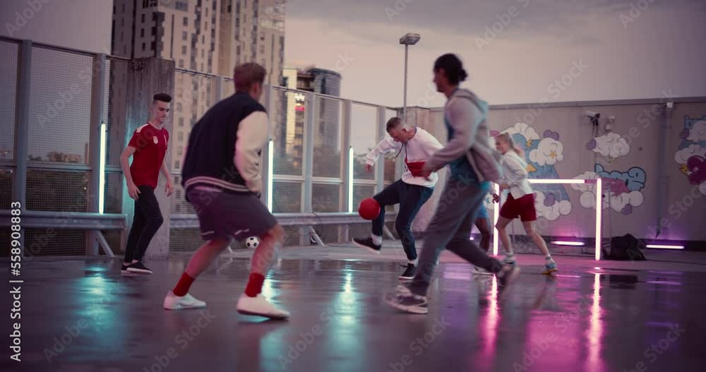 Stylish Young Soccer Player Skilfully Dribbling Ball During a Street ...