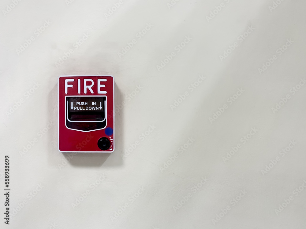 The fire alarm is mounted on the wall. to be used as a warning signal ...