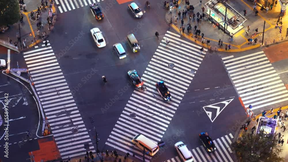 TOKYO - OCT 3rd, 2022: Aerial view of people and traffic crossing the ...