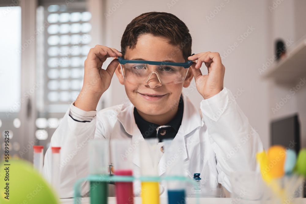 Boy having fun with chemistry lab in his living room. Science ...