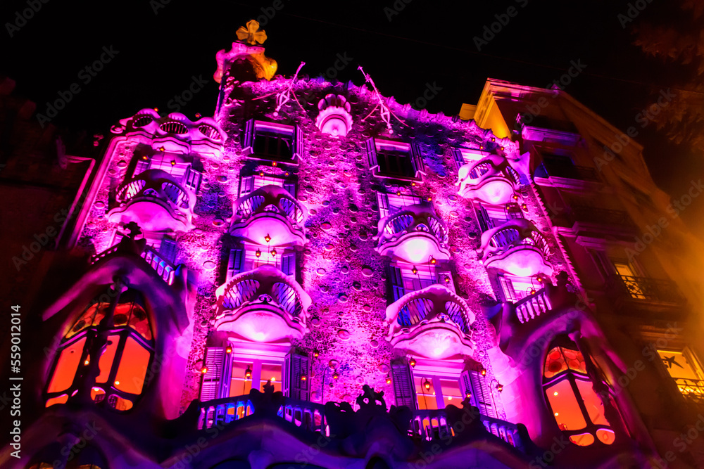 Night view of illuminated facade of the Casa Batllo designed by ...