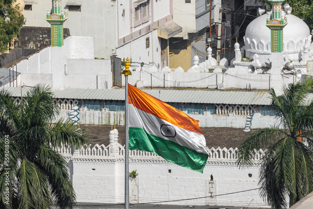 India flag in the middle of old buildings in Hyderabad city suburbs ...