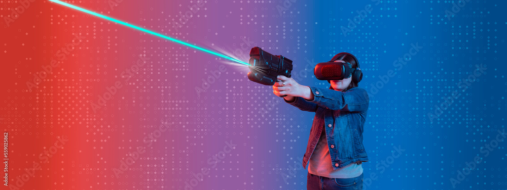 Hispanic woman wearing virtual reality goggles holding her gaming ...