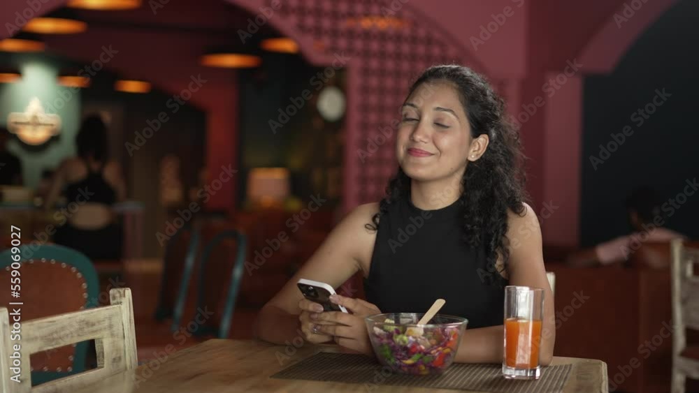 close-up smiling Asian female holding smart phone using mobile apps ...