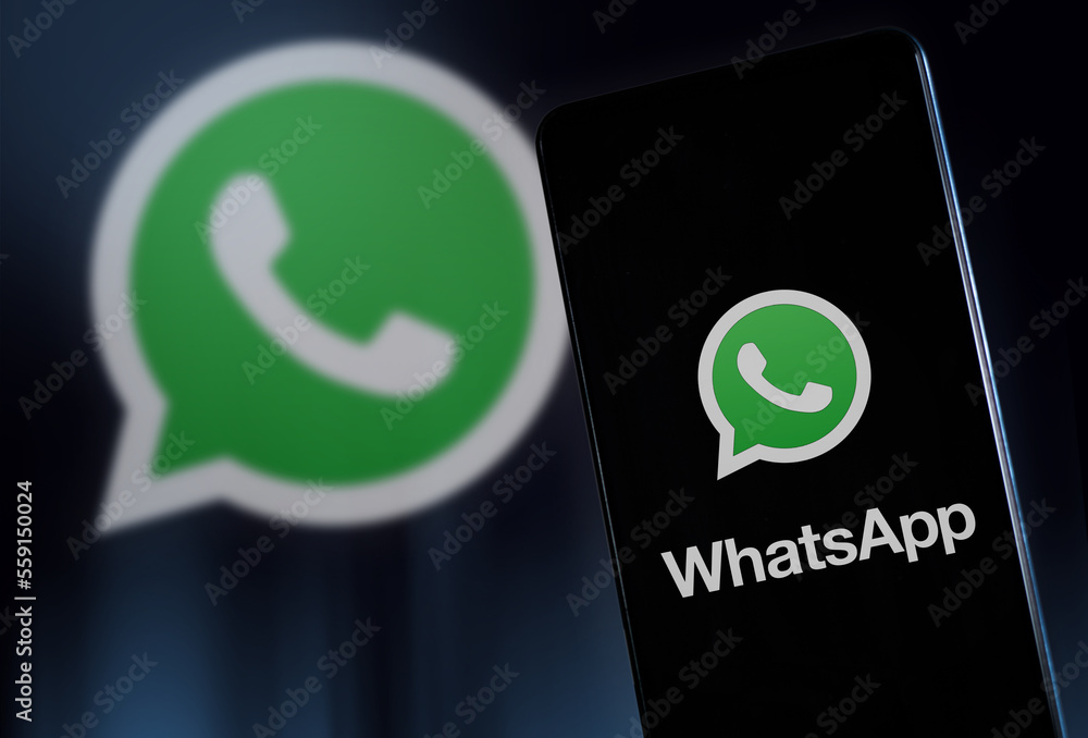 Whatsapp logo on smartphone display and background. Social media ...