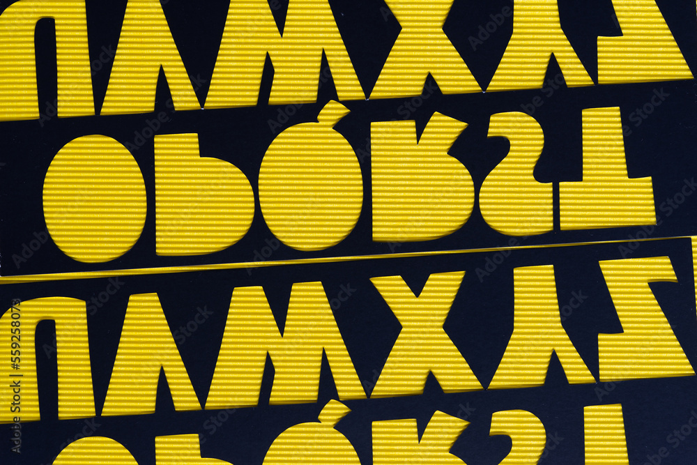 reversed and flipped stencils with alphabet letter cutouts on grungy ...