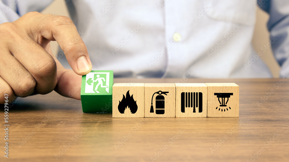 Hand choose cube wooden toy block stack with door exit sing or fire ...