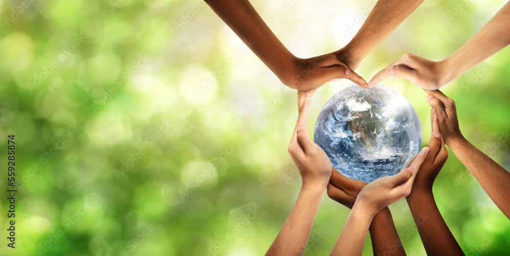 Conceptual symbol of multiracial human hands surrounding the Earth ...