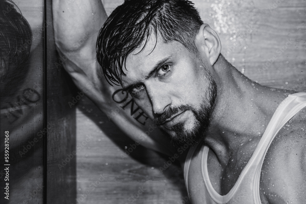 Portrait of muscular handsome young man in shower. Perfect body & skin ...