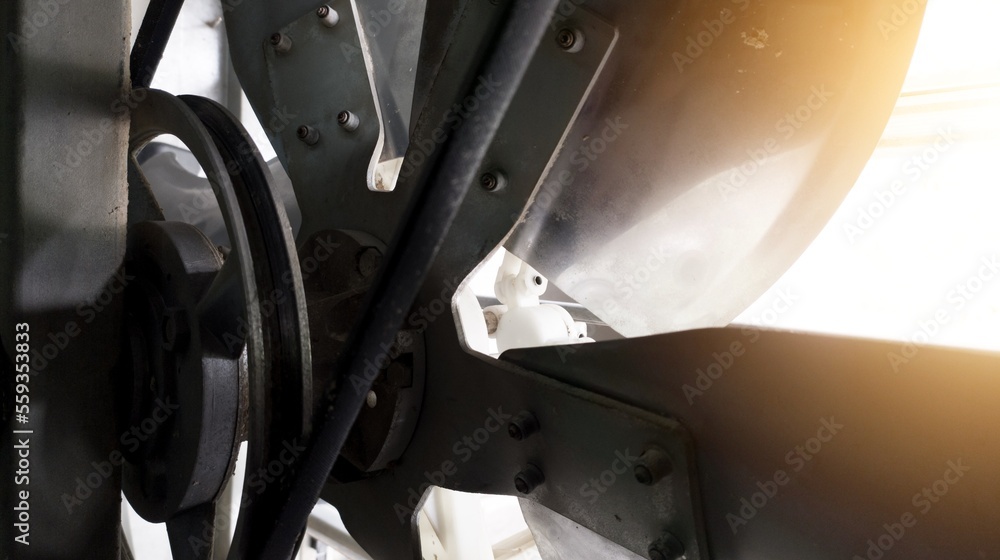 Exhaust fan blades use an electric motor drive connected to a vbelt ...
