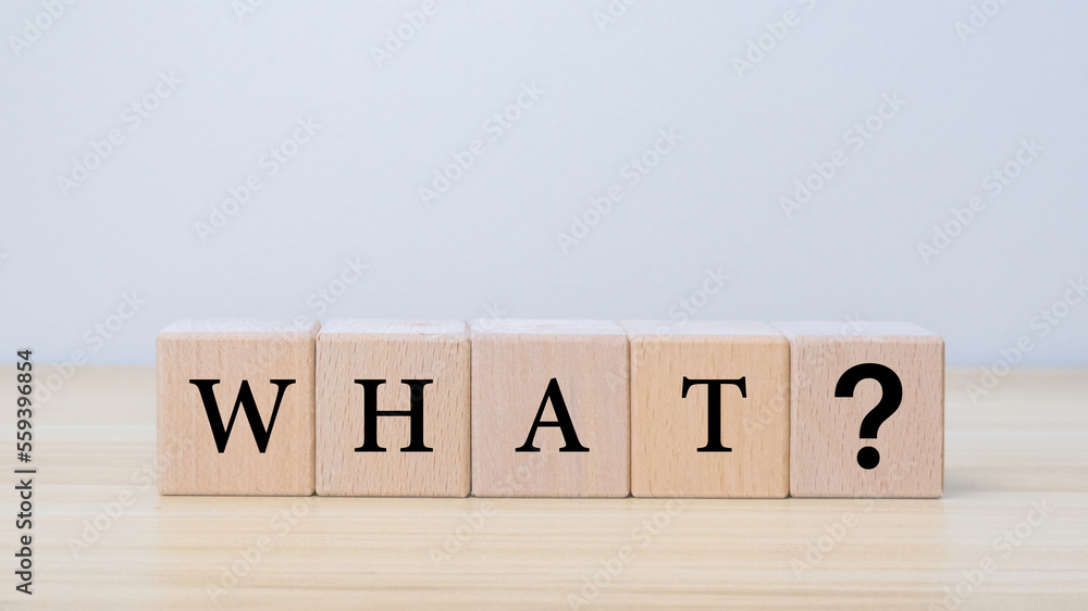 Question "what" word with black wooden cube on wooden table background ...