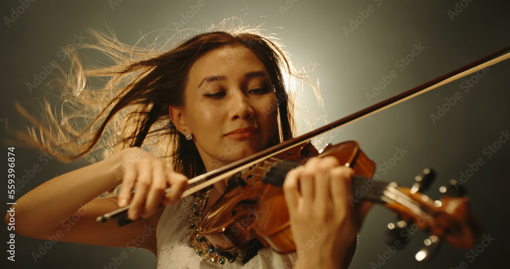 Professional female violin player performing an amazing solo during ...