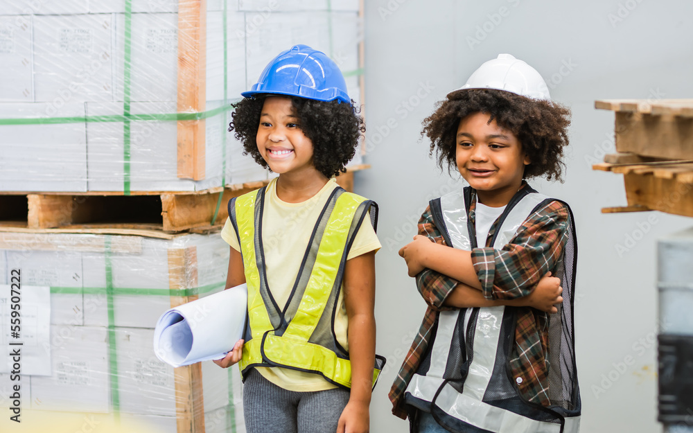 Two African little boy, girl kids standing in warehouse, dream to be ...