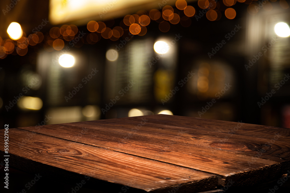 dark blurred background with empty table top, cafe restaurant windows ...