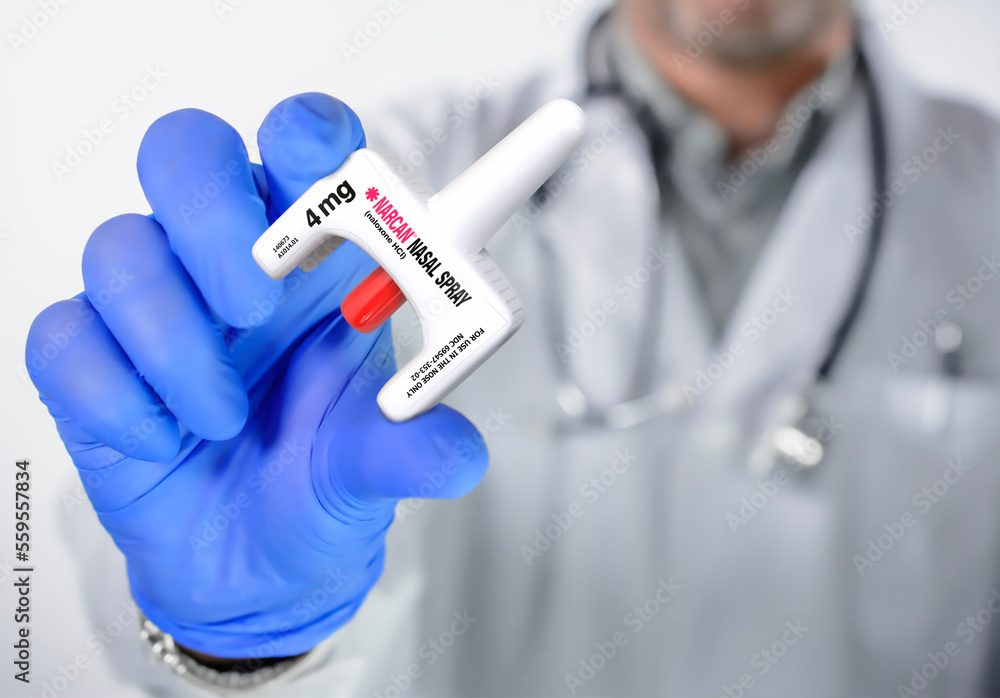 Doctor holds Naloxone spray in hand. Food and Drug Administration ...
