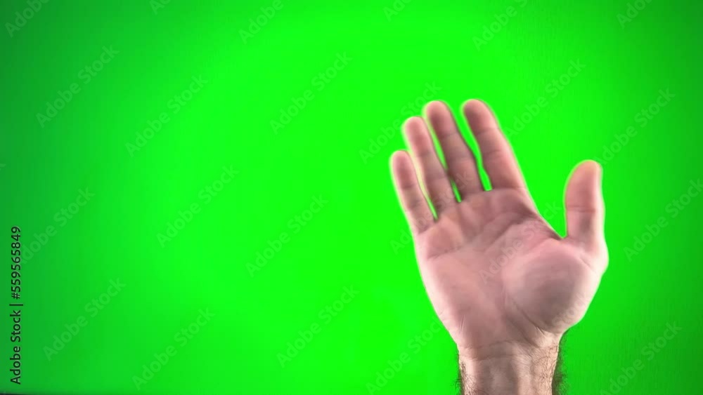 Male hand gesture isolated at bright green screen background. Punch and ...