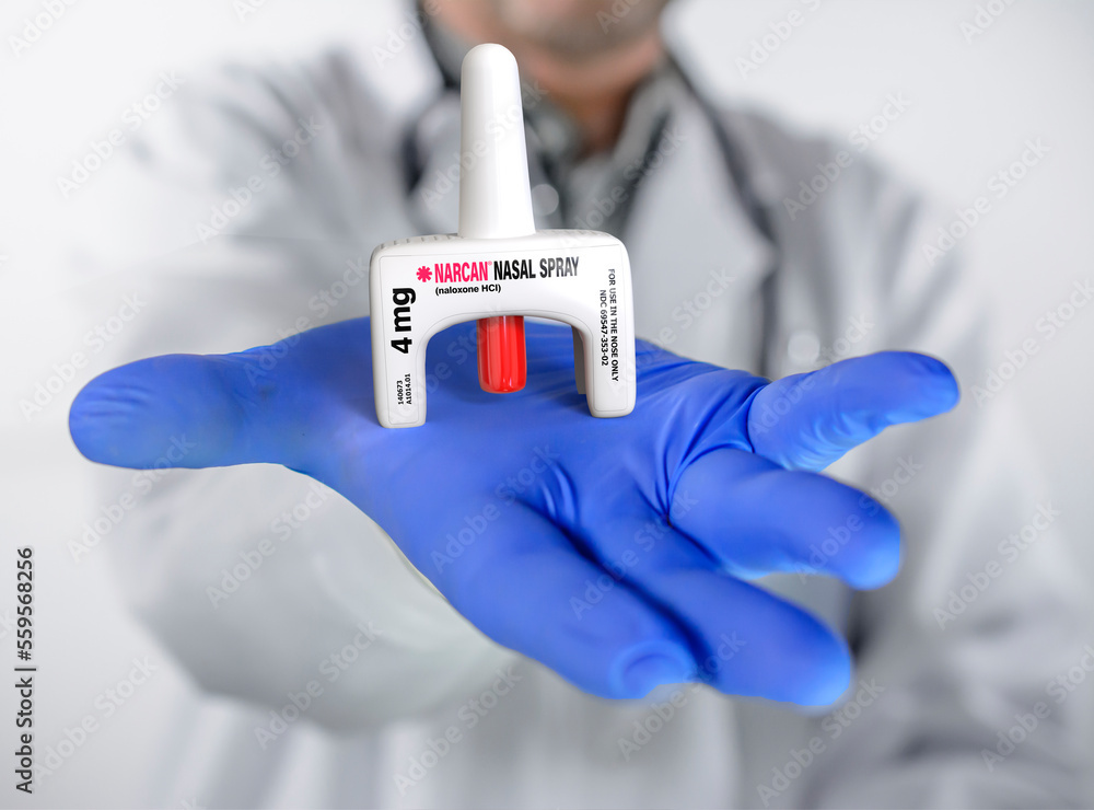 Doctor holds Naloxone spray in hand. Food and Drug Administration ...