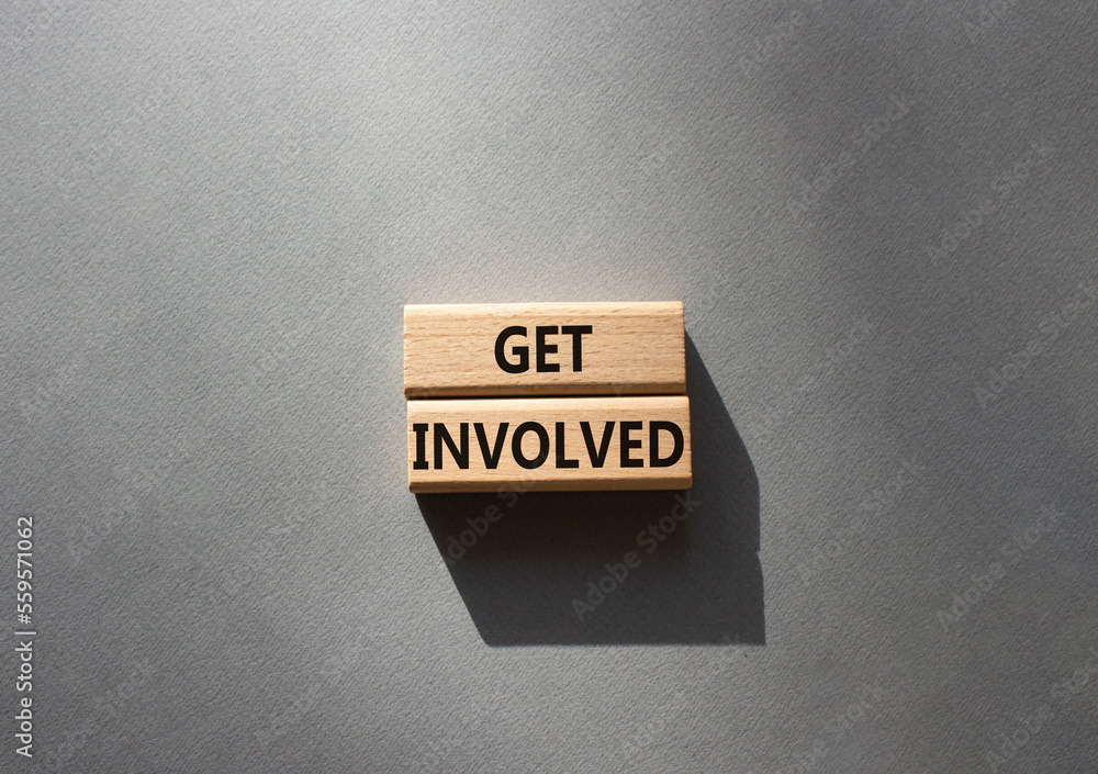 Get involved symbol. Wooden blocks with words Get involved. Beautiful grey background. Business ...