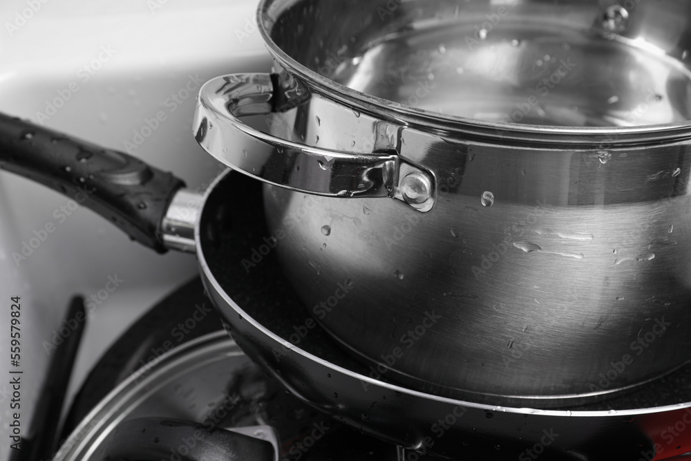 Stack of clean kitchenware in sink, closeup Stock Photo | Adobe Stock