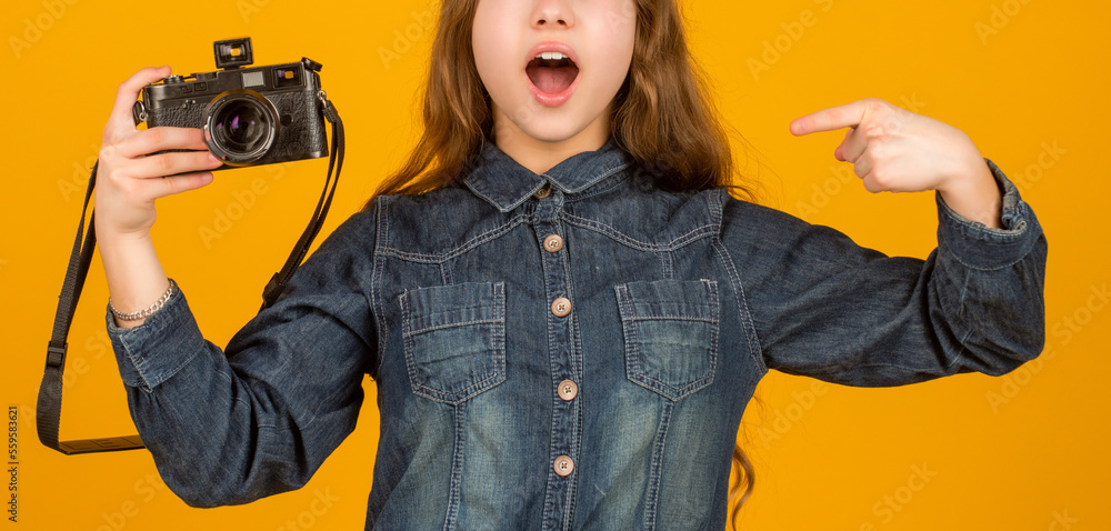 Surprised kid crop view pointing finger at camera yellow background ...