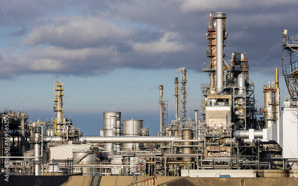 Industrial facility at a refinery with smokestacks for fuel production ...