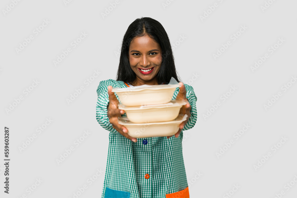 Young Indian woman child education teacher holding takeaway food ...